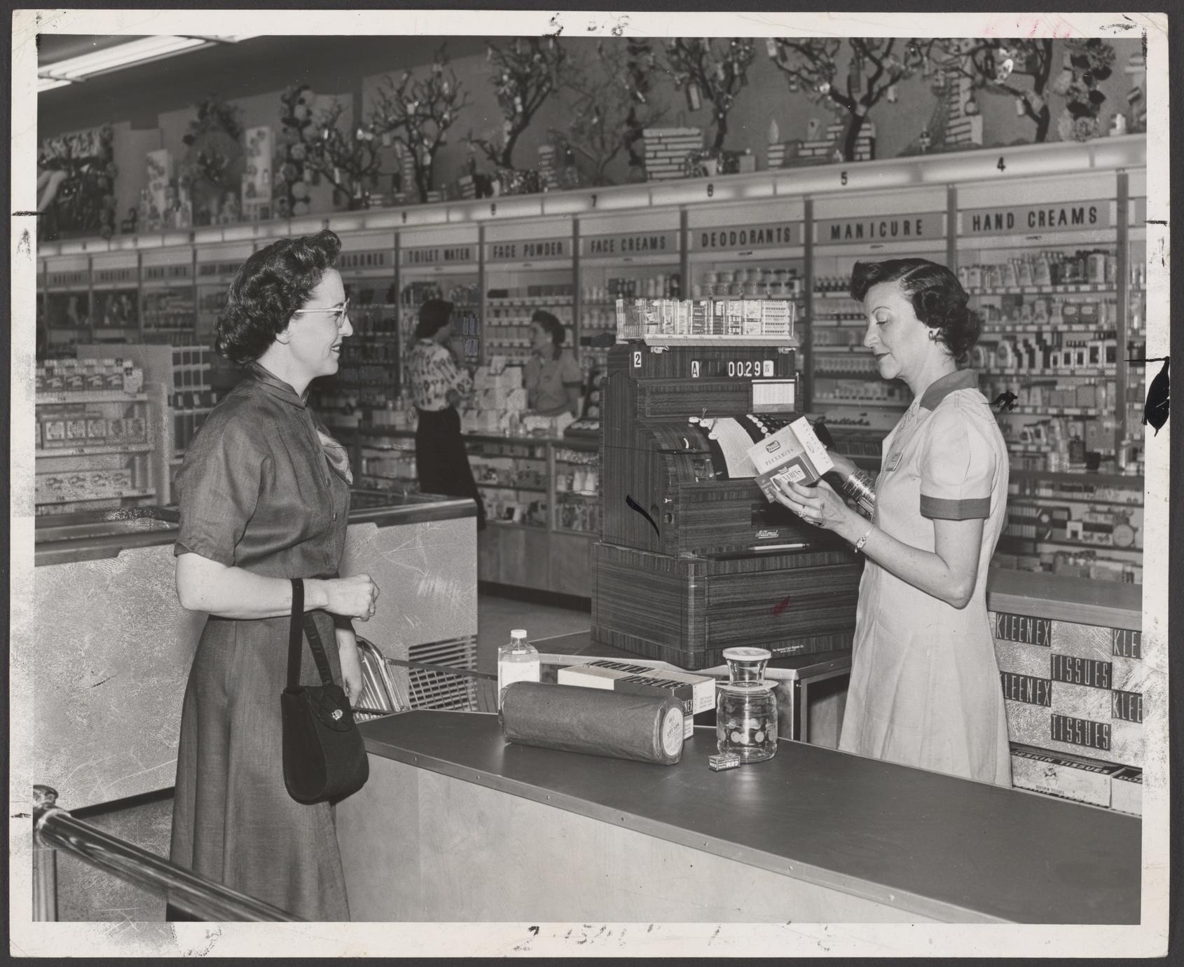 ‎A woman stands at a drugstore checkout counter - UWDC - UW-Madison ...