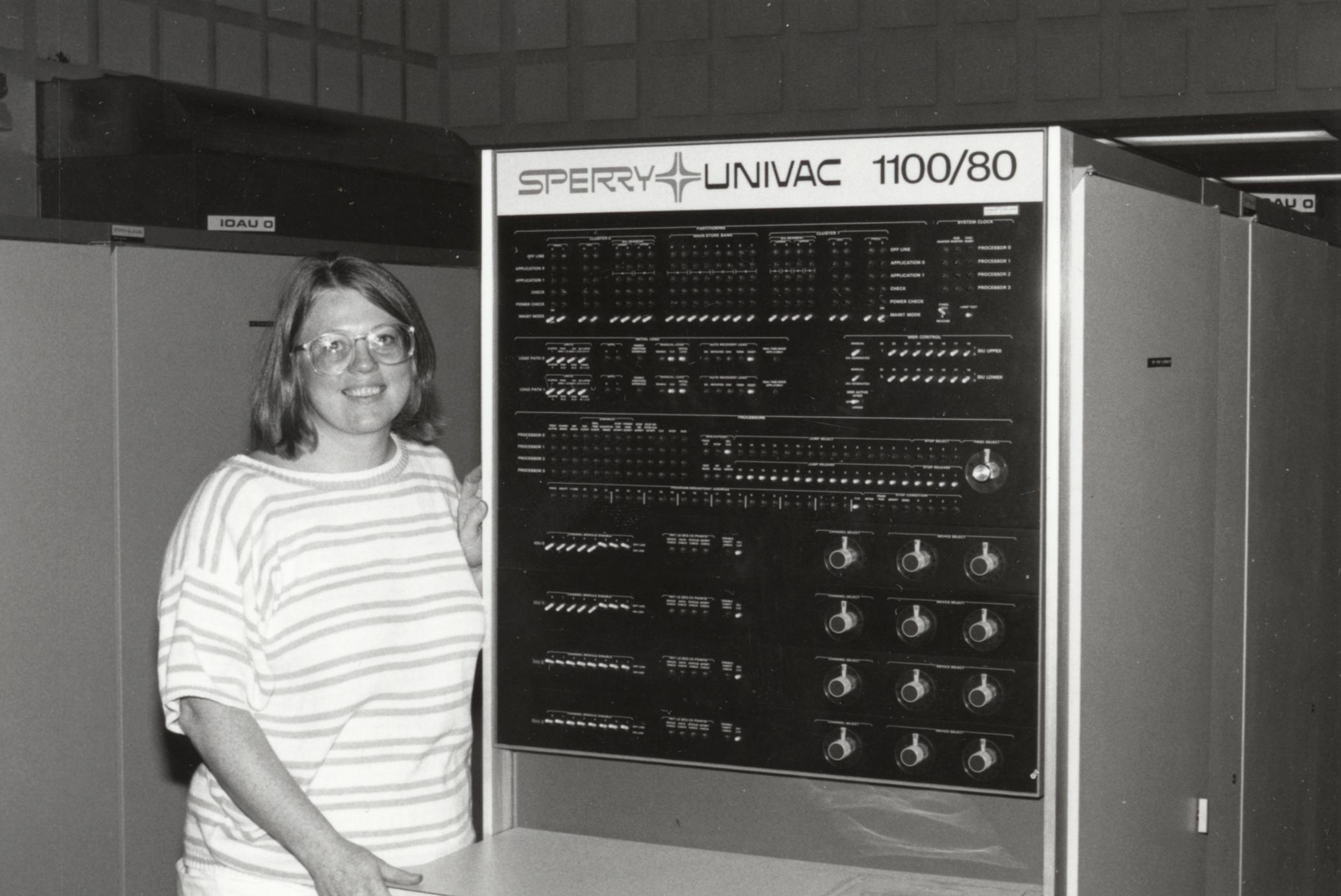 ‎Rose Smith standing next to the UNIVAC 1100/80 - UWDC - UW-Madison Libraries