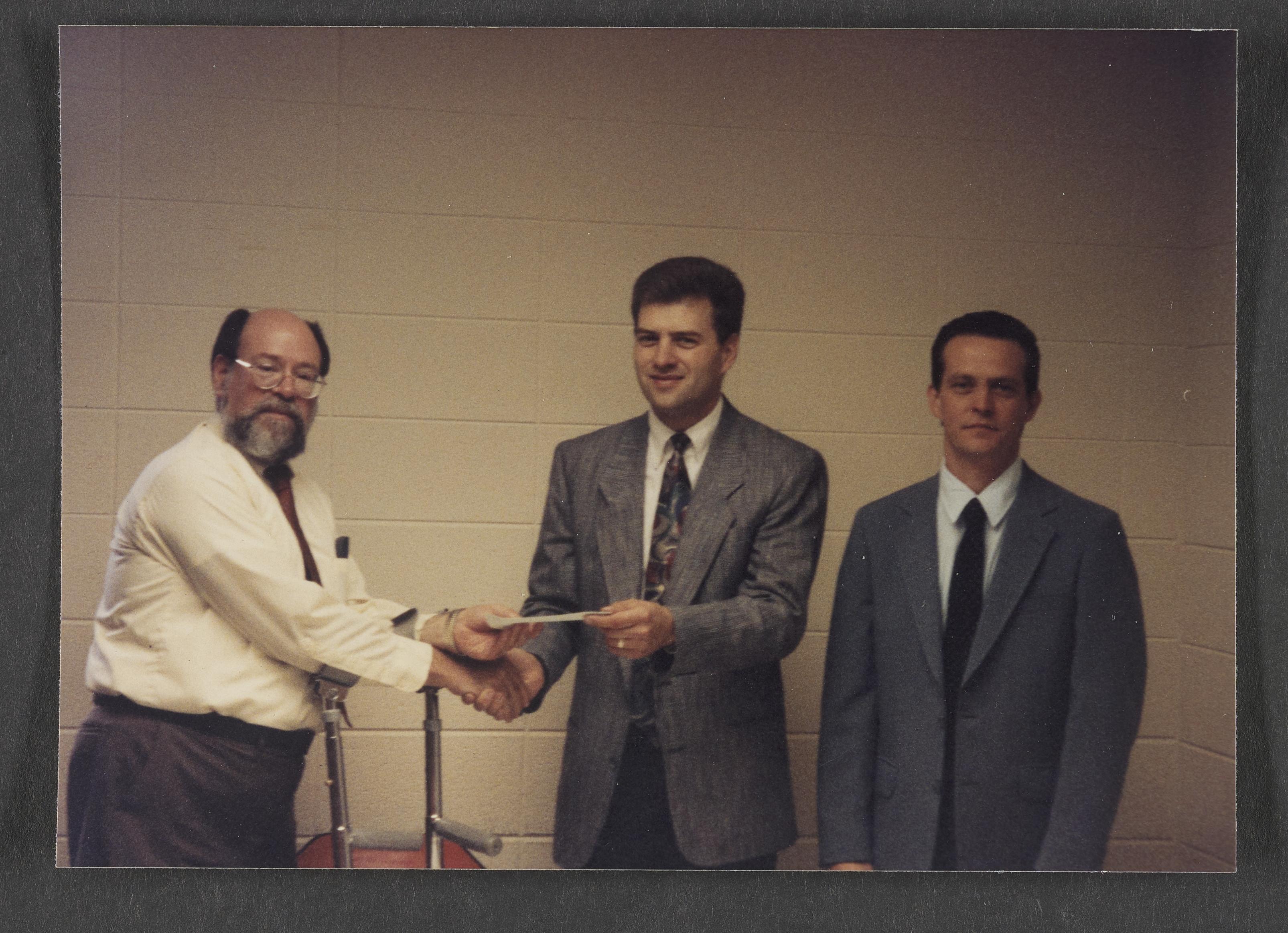 ‎Dean Joel Rodney presented a check for Emergency Loan Fund - UWDC - UW ...