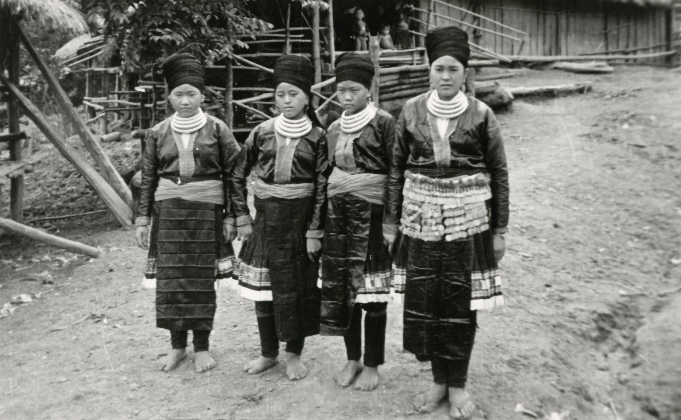 ‎Four Blue Hmong (Hmong Njua) women pose in a Hmong village in the vicinity of Muang Vang Vieng ...