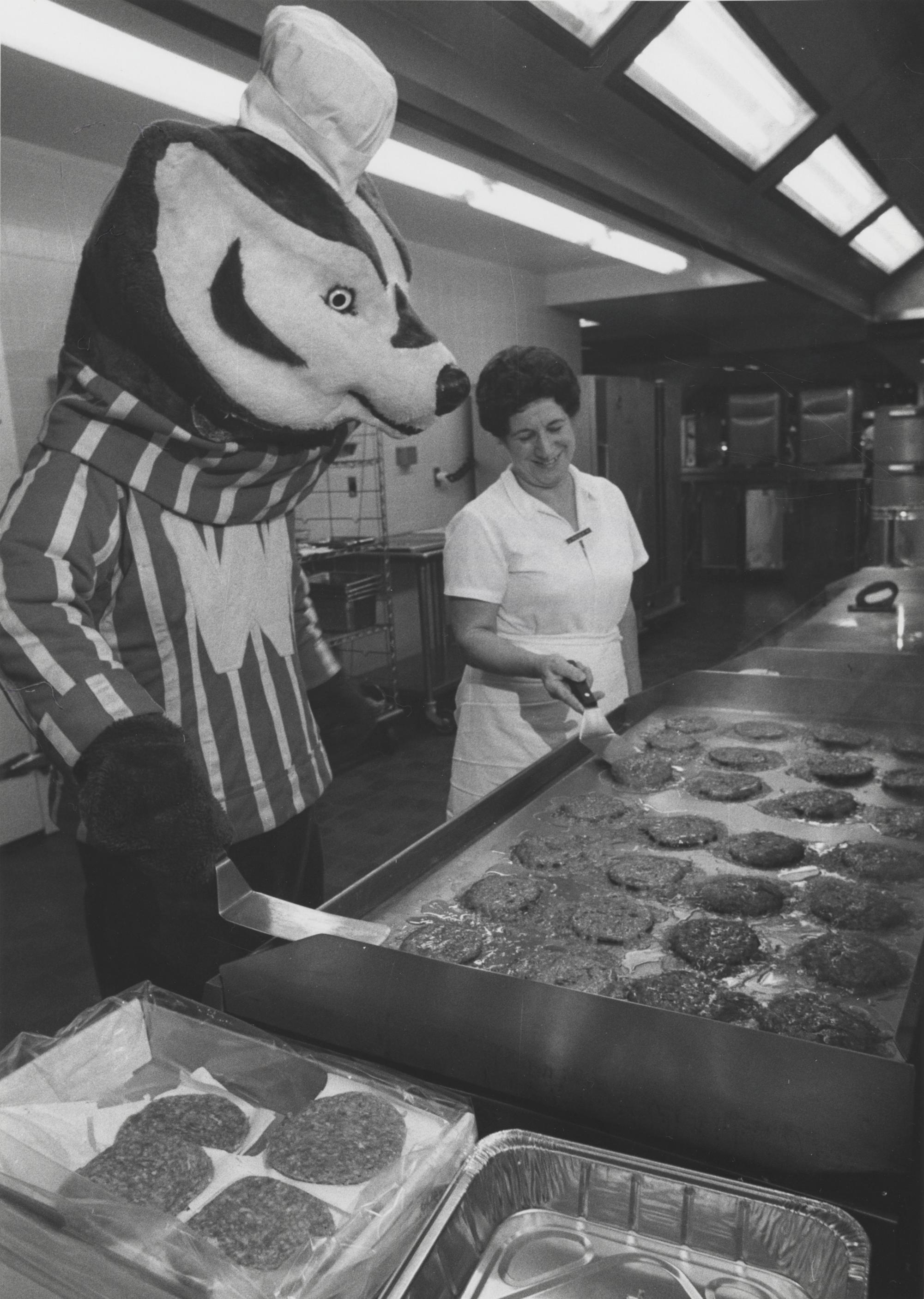 ‎Bucky flipping burgers - UWDC - UW-Madison Libraries