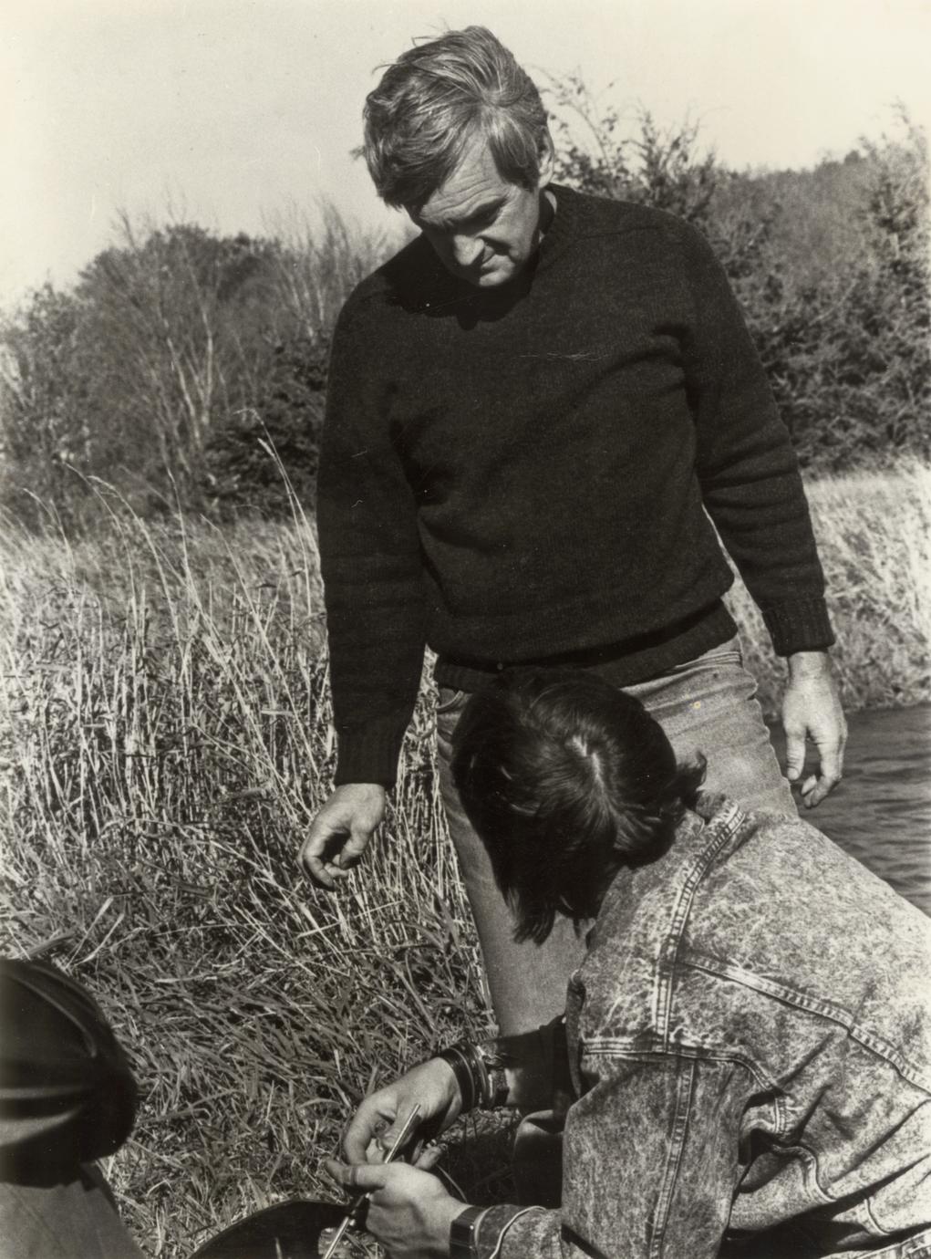 ‎Professor Donald Halloran and a student in a field, University of ...